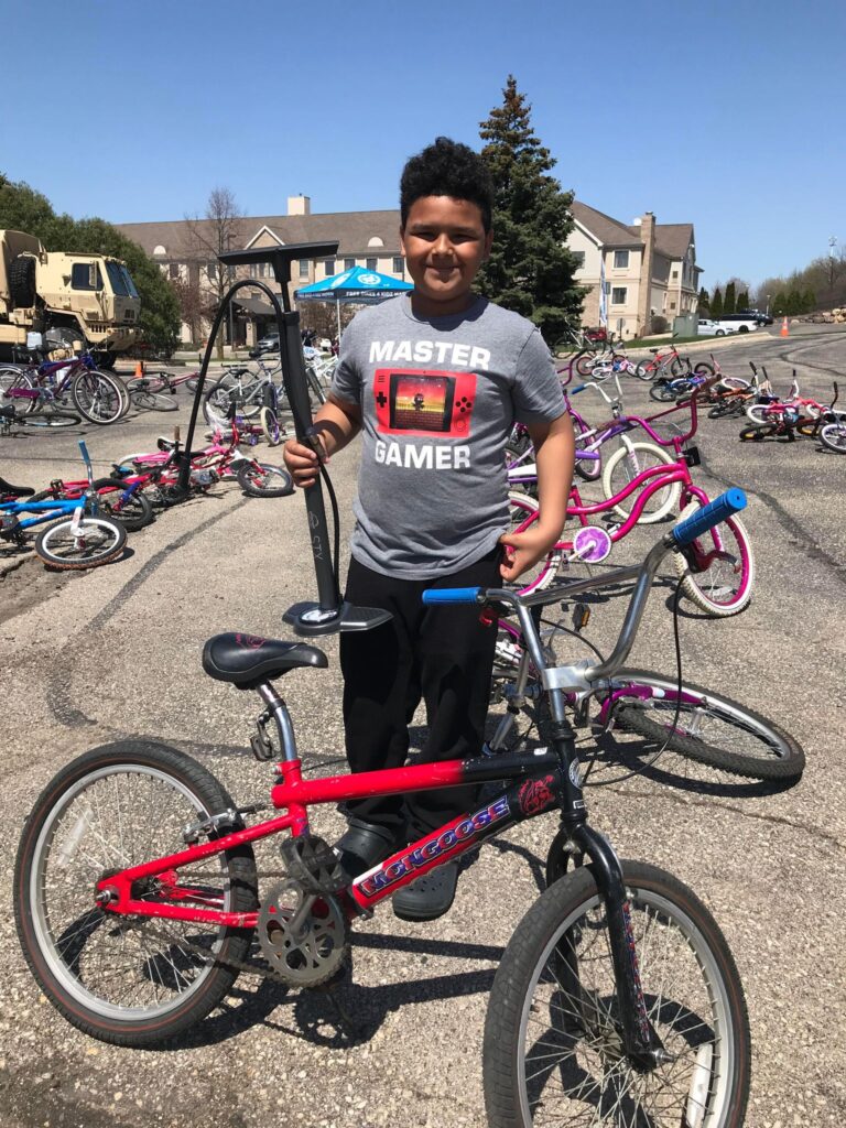 Boy with bike and pump | Bikes for Kids nonprofit bike shop coop ...